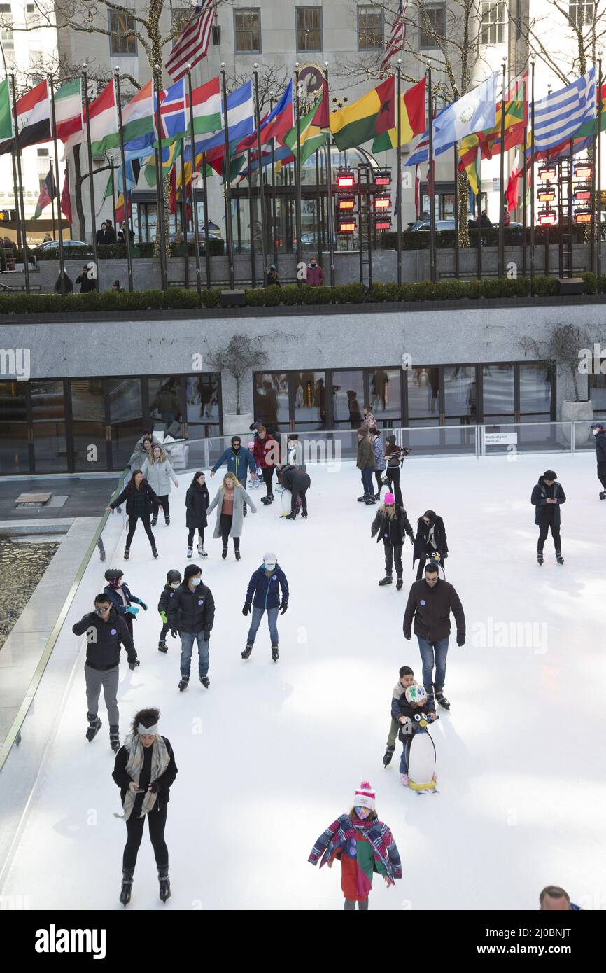 The ice-skating rink at Rockefeller Center is a popular tourist ...