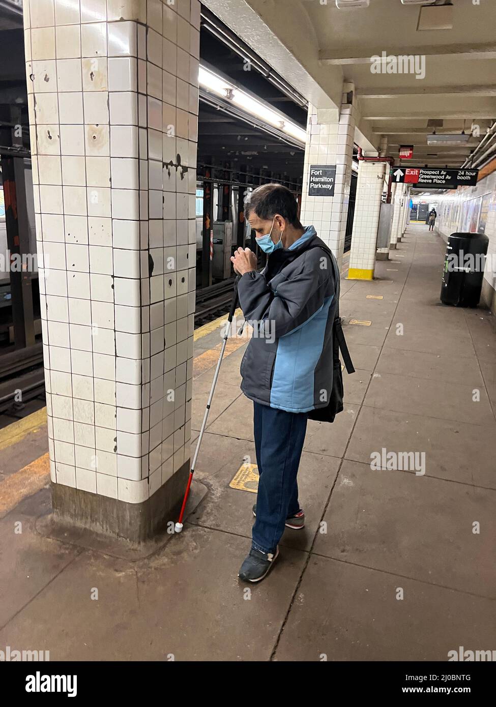 Blind man on the subway platform waiting for a train in Brooklyn, New ...