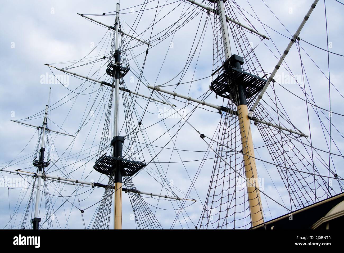 Sailing ship with tall masts against a blue sky Stock Photo - Alamy