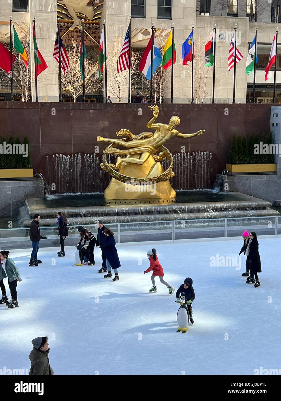 People enjoy ice skating in midtown Manhattan at Rockefeller Center ...