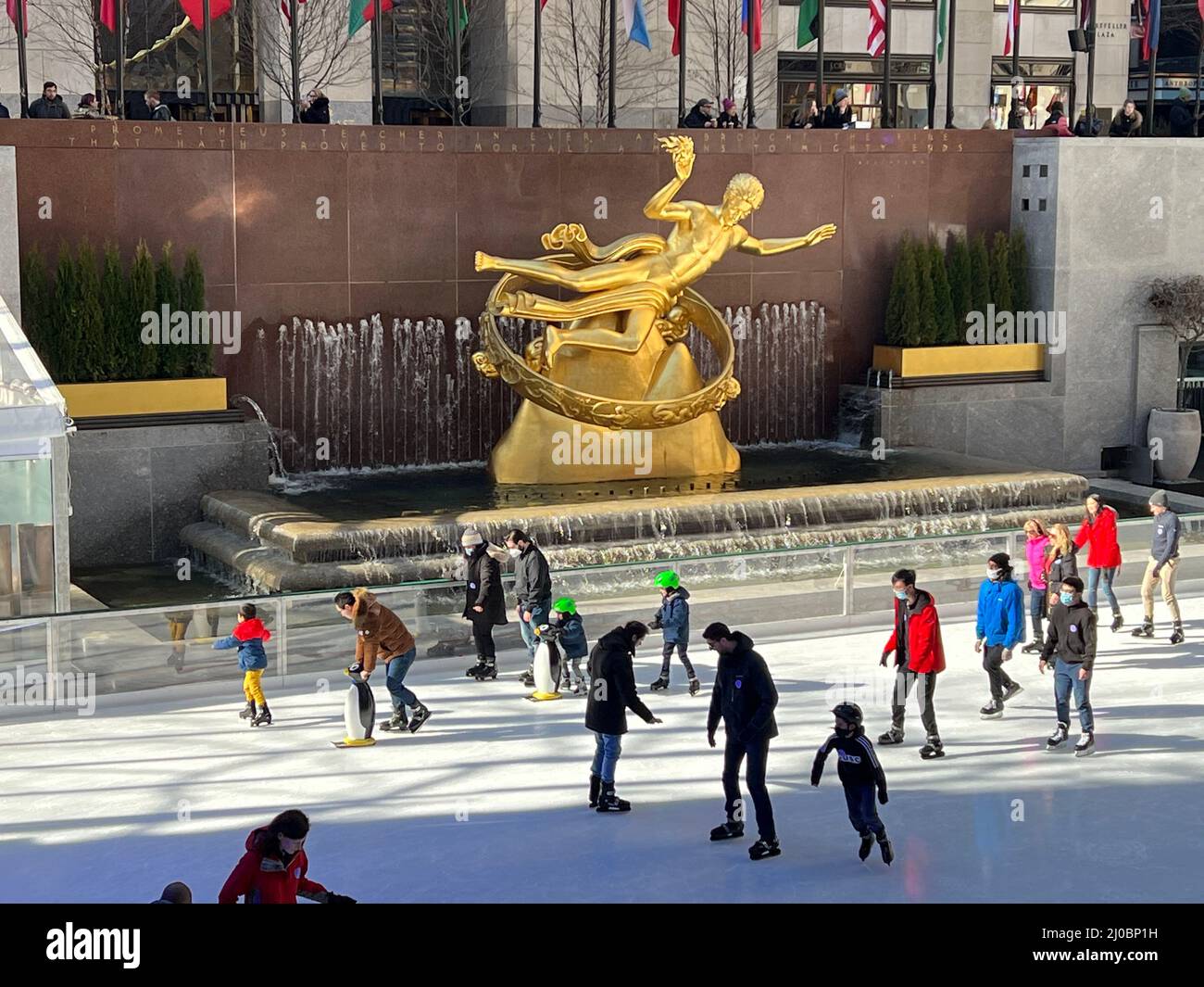 People enjoy ice skating in midtown Manhattan at Rockefeller Center ...