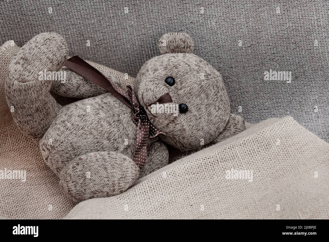 rustic style teddy bear on hessian and rough fabric Stock Photo - Alamy