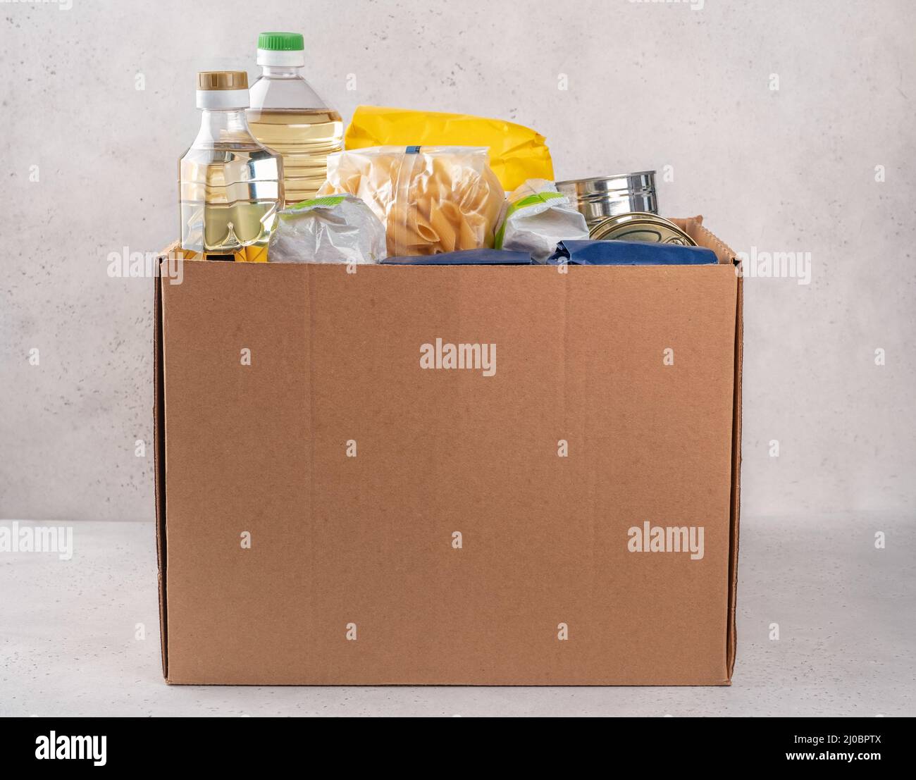 Donation box with food. Humanitarian aid Stock Photo - Alamy