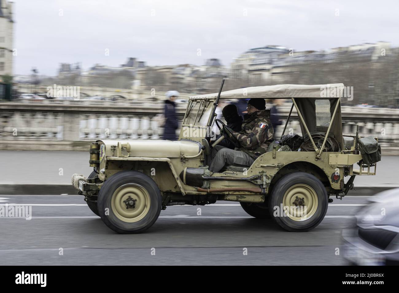 Old American off road vehicle used in World War II driving in the city ...