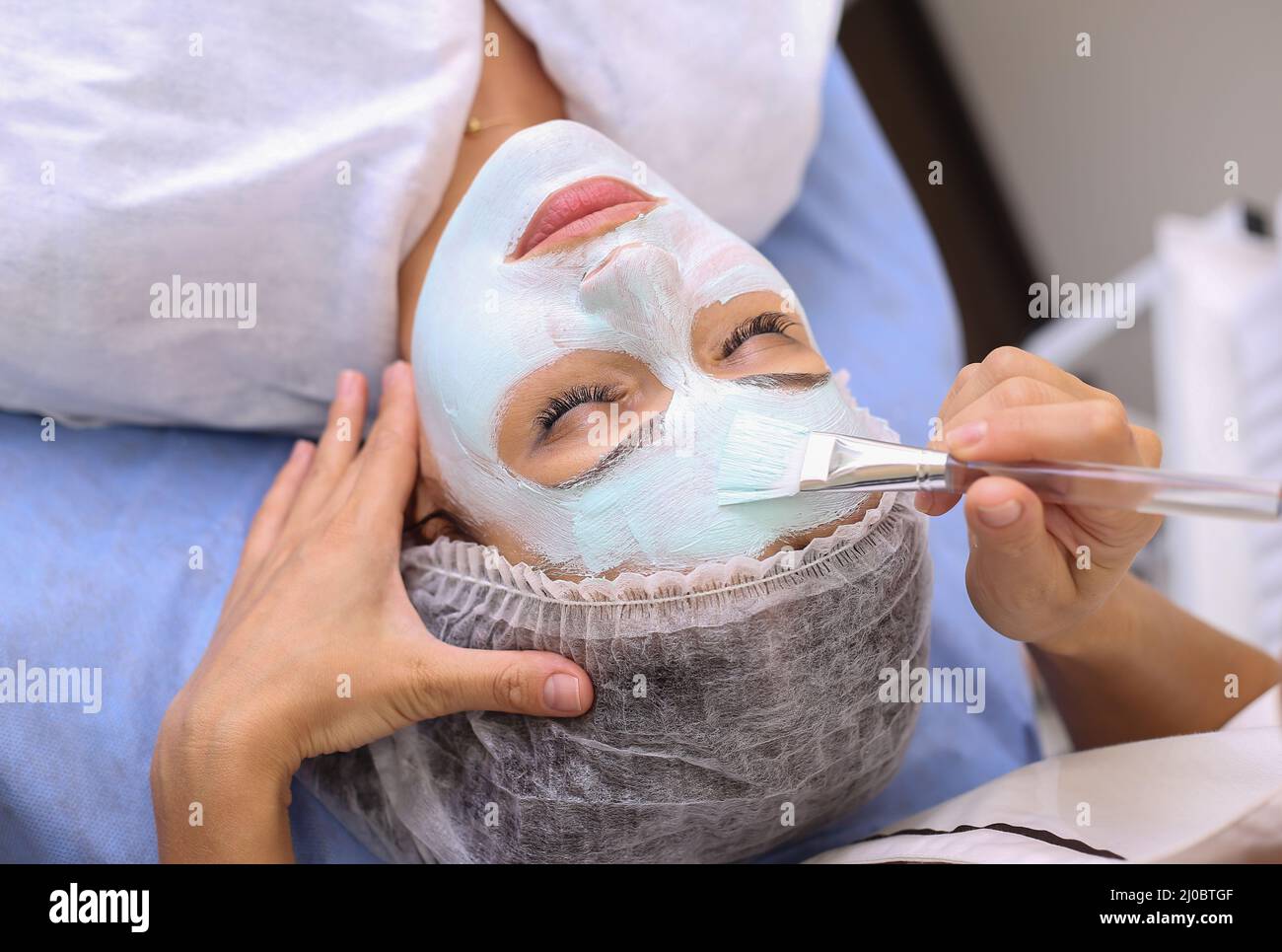 Beautiful woman with facial mask hi-res stock photography and images ...