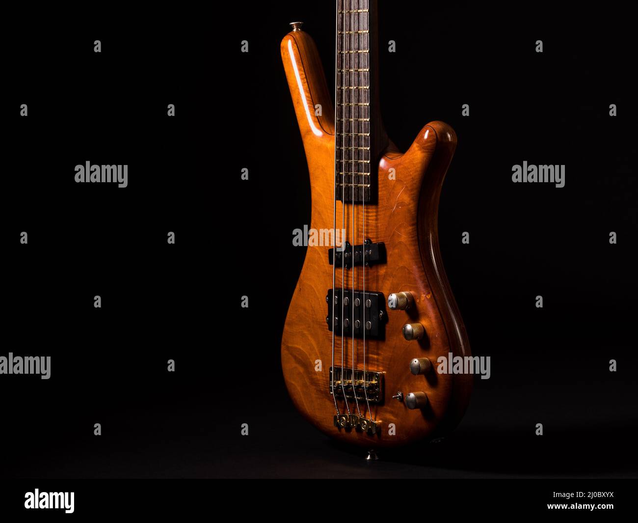Warwick bass orange body in semi profile Stock Photo - Alamy
