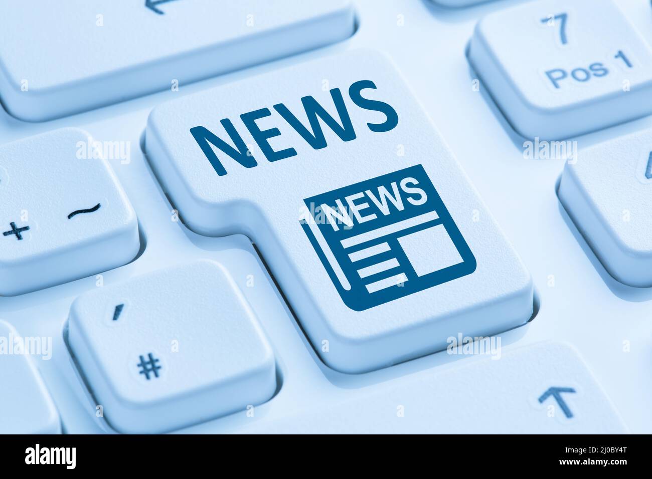 Online newspaper news computer keyboard blue Stock Photo - Alamy