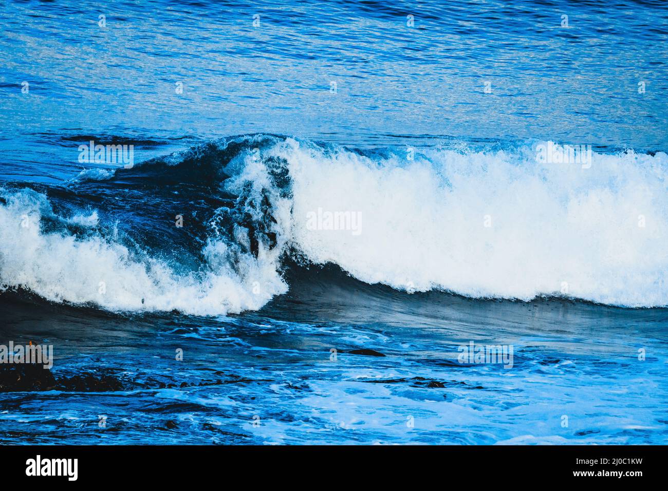 a photo of big blue ocean waves Stock Photo - Alamy