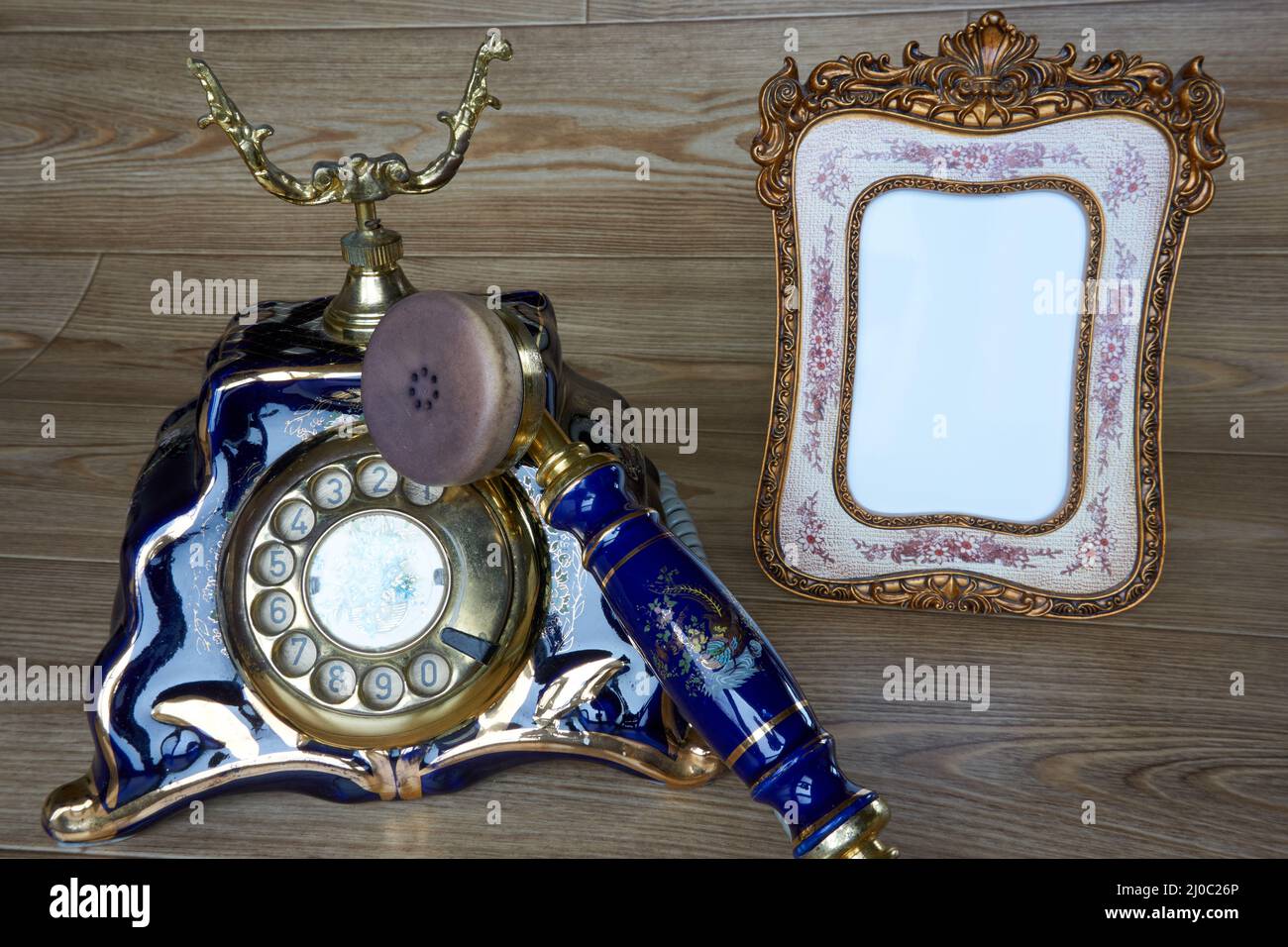 Retro telephone and photo frame Stock Photo - Alamy