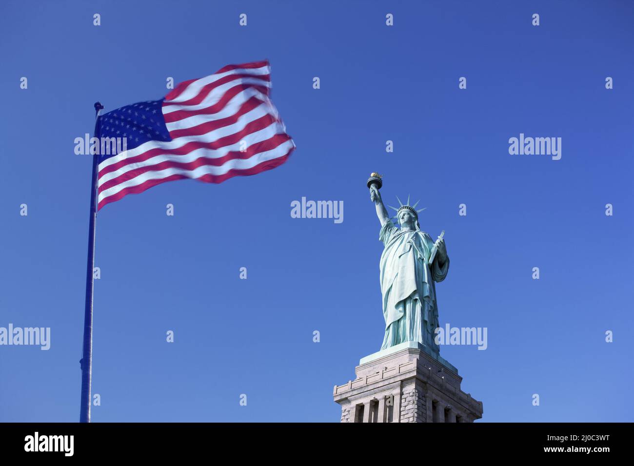 Statue of Liberty and the US Flag Stock Photo - Alamy