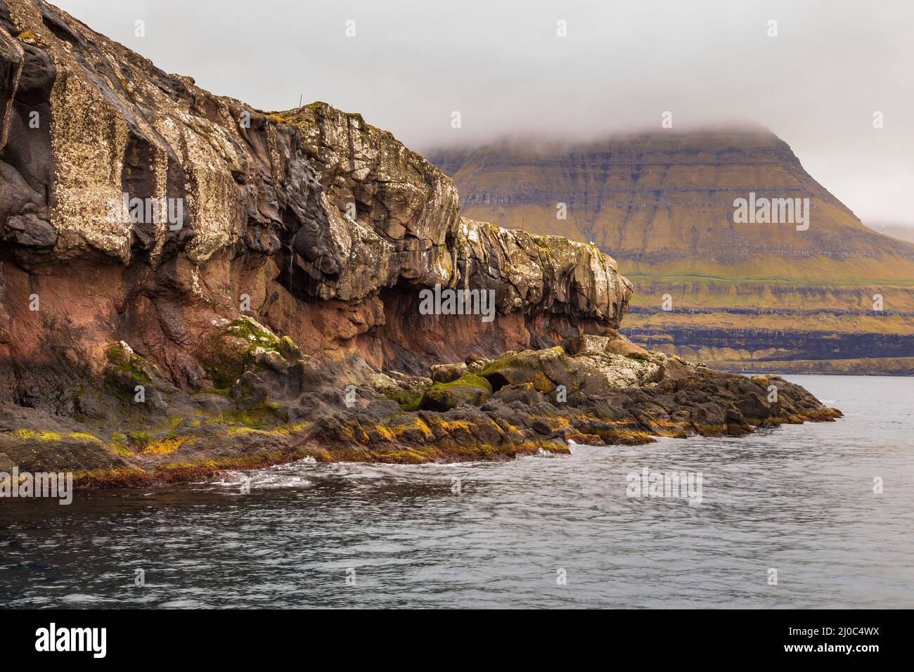 A natural harbor on the island of Eysturoy in small village Endalvik ...