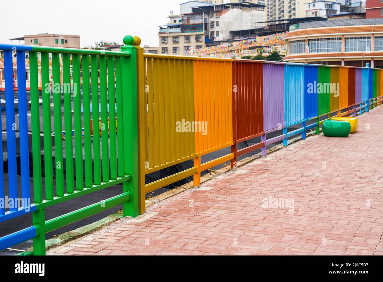 Closeup of rainbow colored railings in the city Stock Photo - Alamy