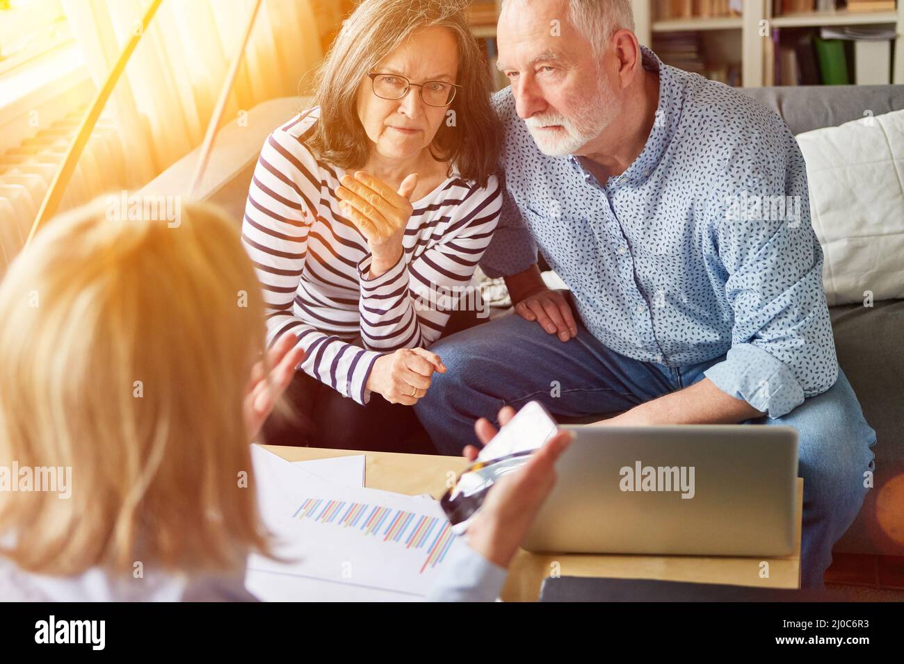 Couple of seniors having counseling session for retirement planning and ...