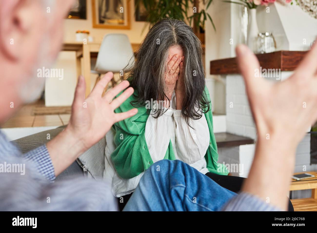 Crying woman and scolding man at home as a symbol of relationship ...