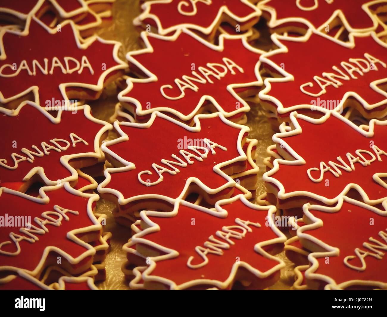 Redglazed maple shaped coookies with Canada written with icing Stock ...