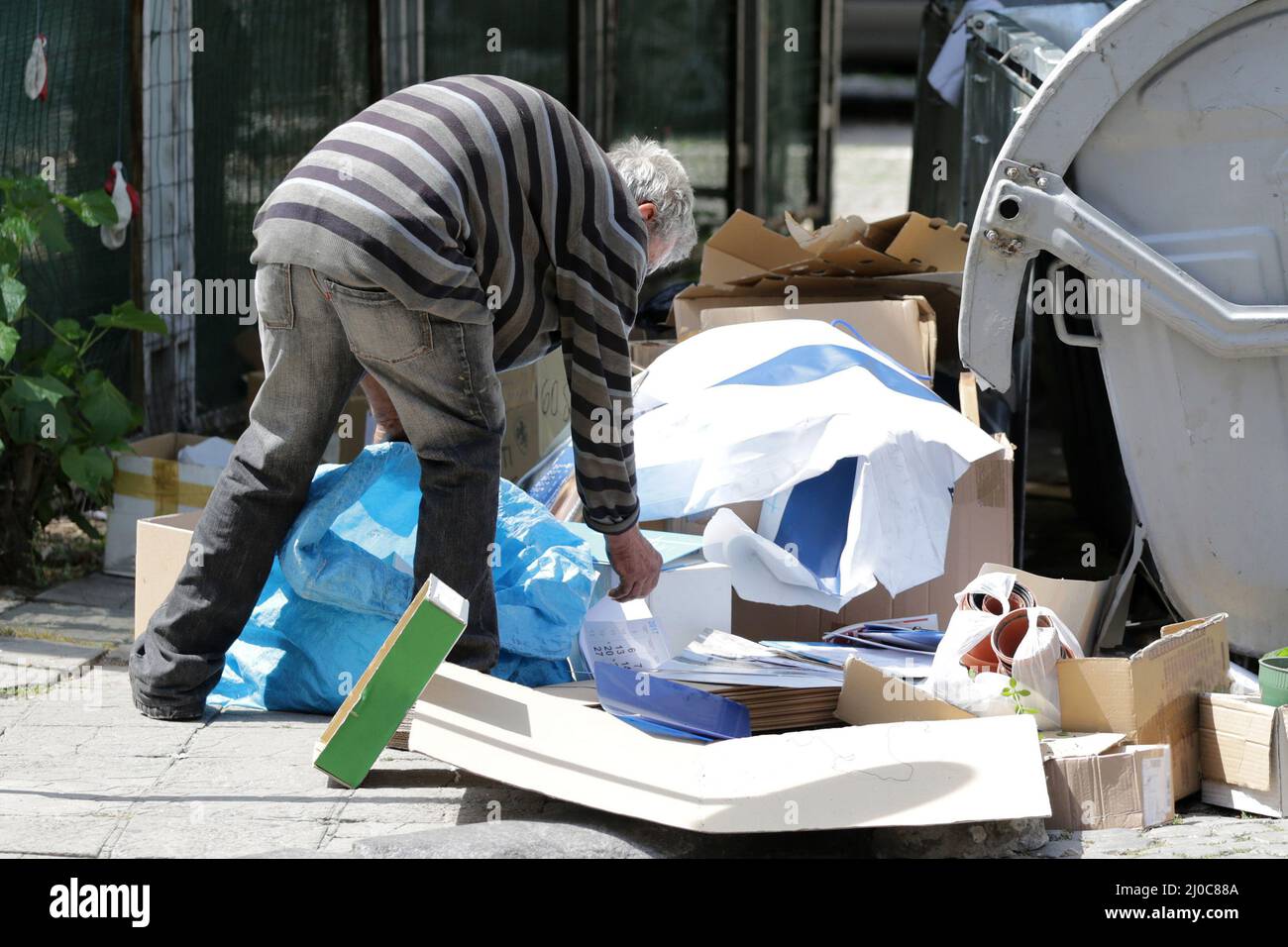 Poor collecting trash hi-res stock photography and images - Alamy