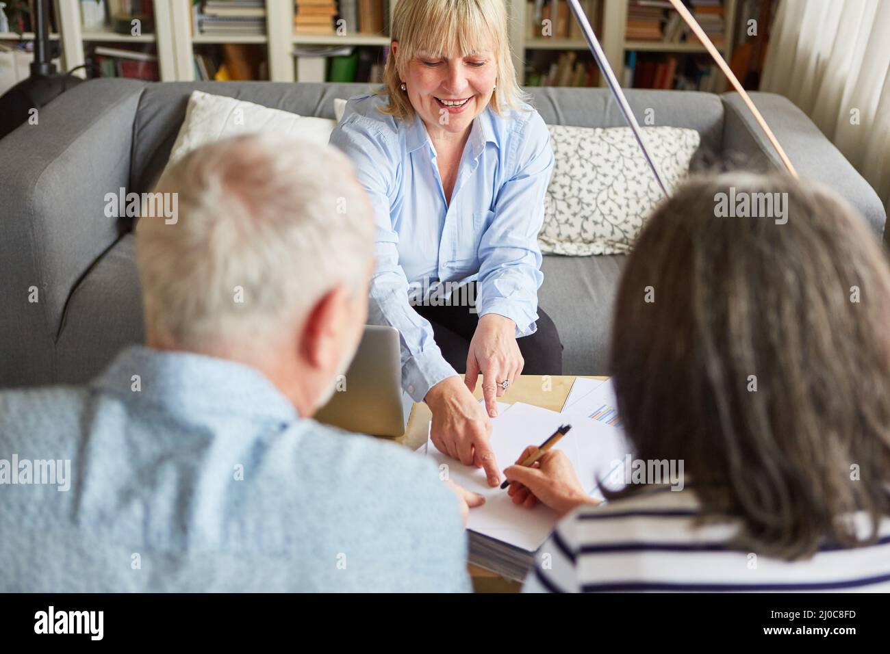 Seniors sign a power of attorney or contract at home after consultation ...