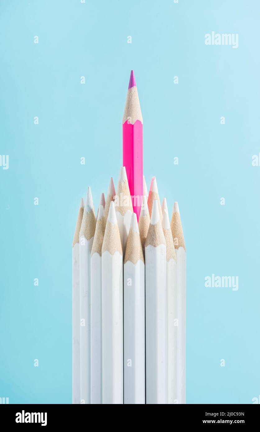 Business concept - lot of white pencils and one color pencil stand on ...