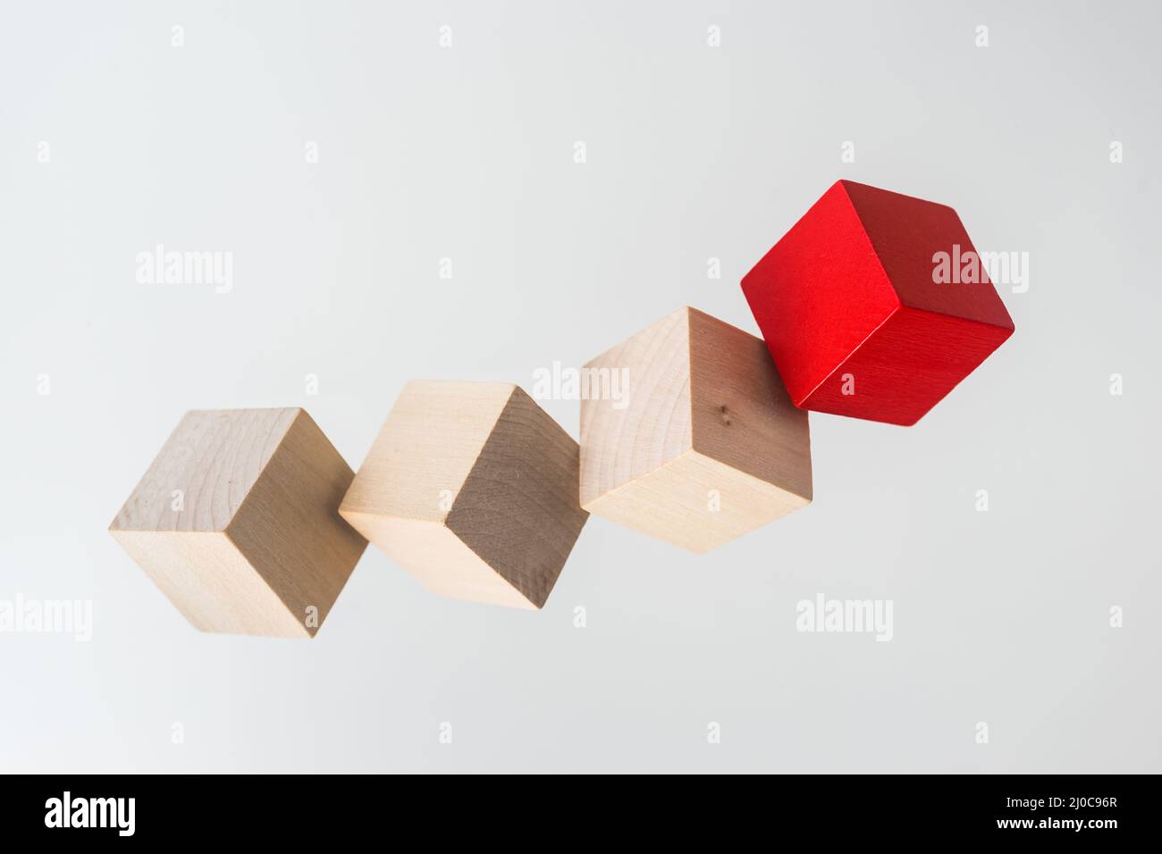 Business concept - Abstract geometric real floating wooden cube on grey ...