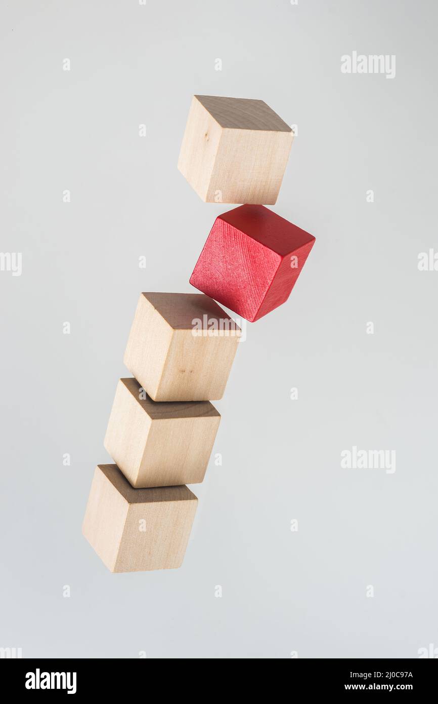 Business concept - Abstract geometric real floating wooden cube on grey ...