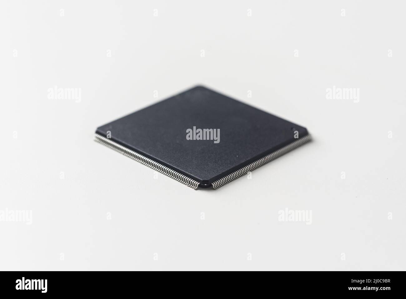 Business concept - semiconductor IC chip isolated on white background ...