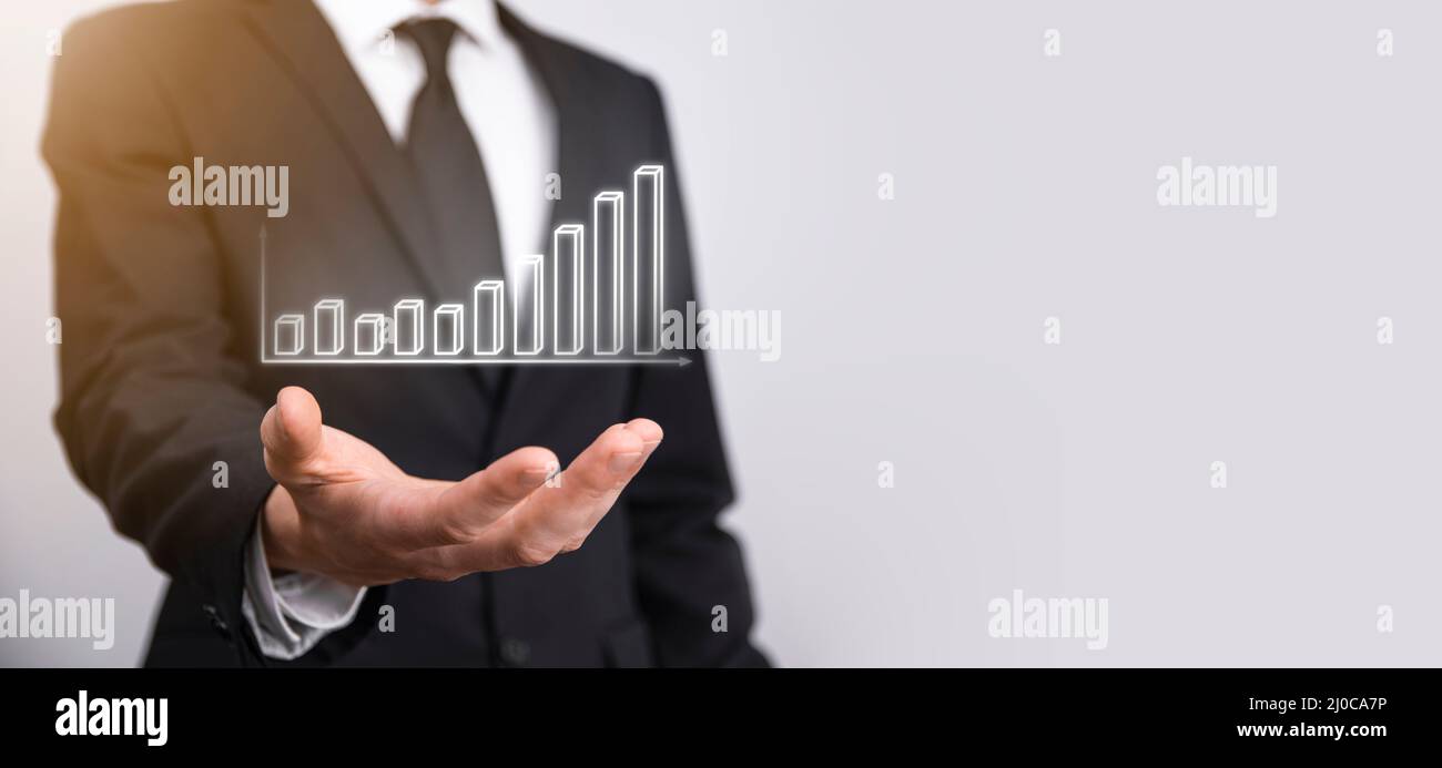 Businessman holding graph growth and increase of chart positive ...