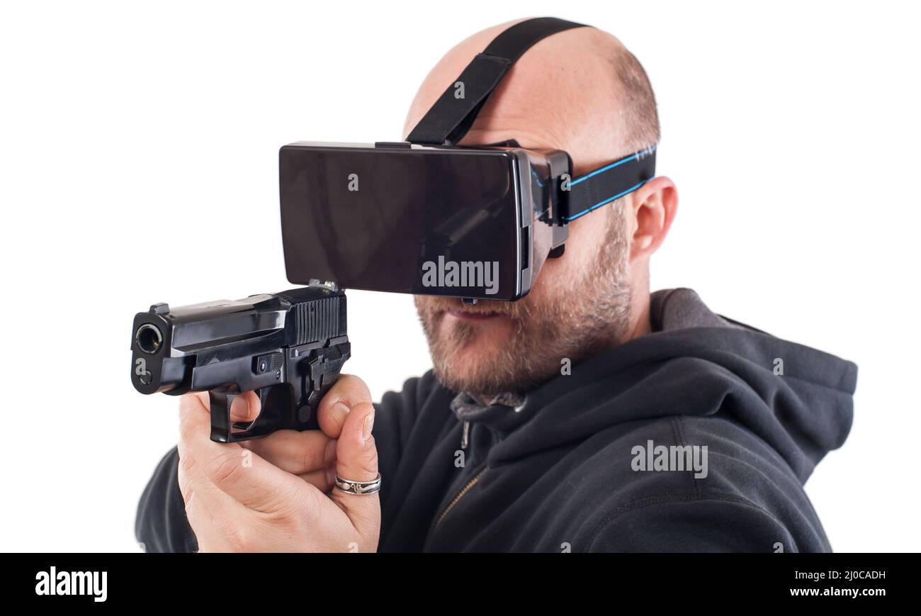 Man play VR shooter game with virtual reality gun and vr glasses ...