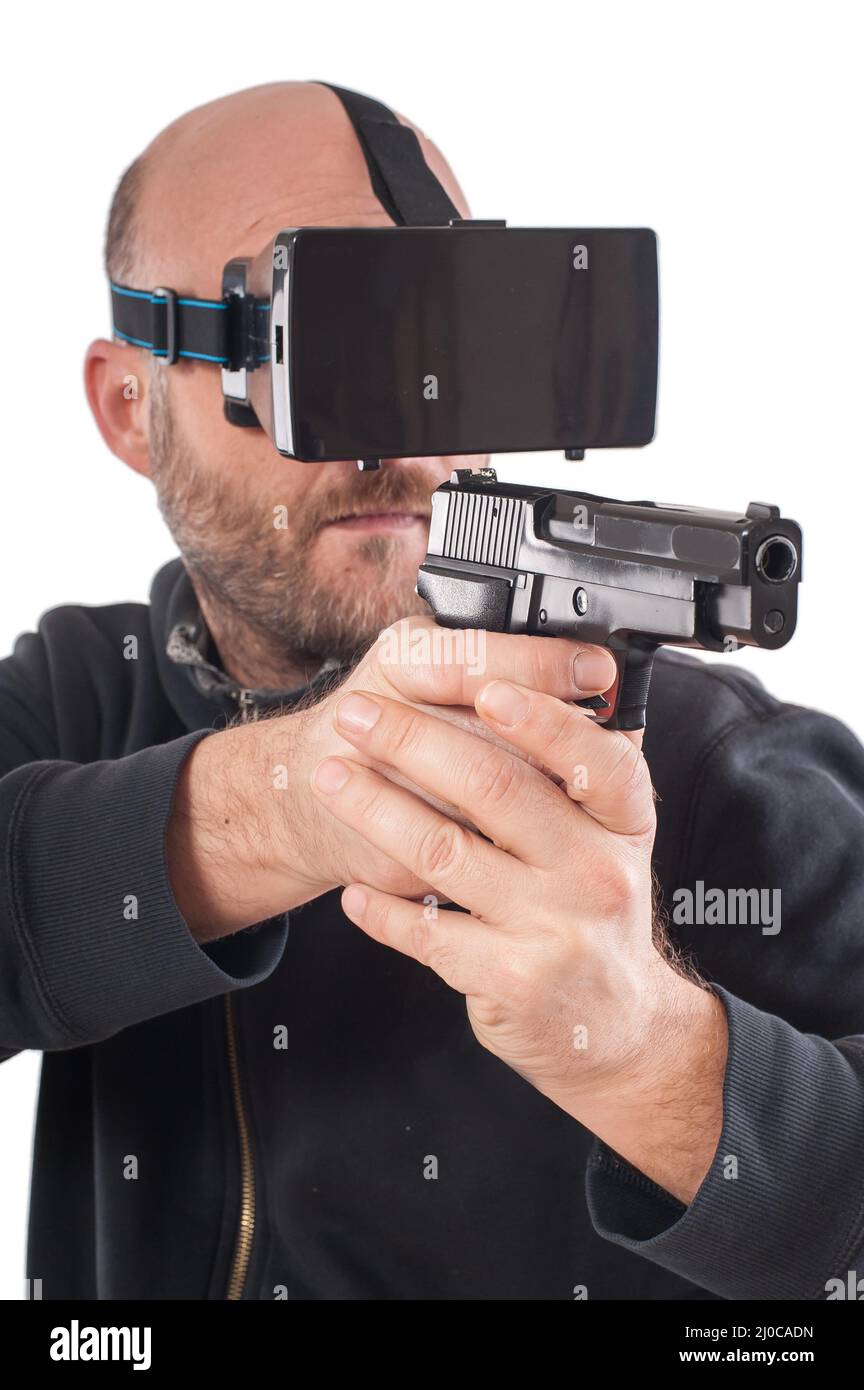 Man play VR shooter game with virtual reality gun and vr glasses ...