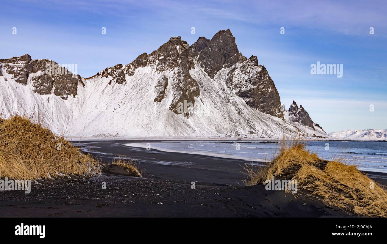 Vestrahorn mountain and dunes and black sand beach and sea at Stokksnes ...