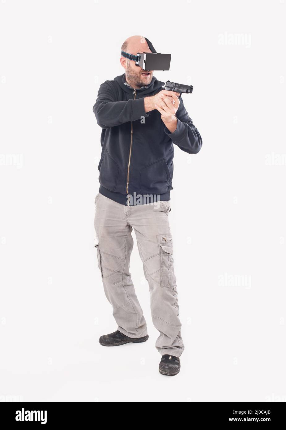 Man play VR shooter game with virtual reality gun and vr glasses ...