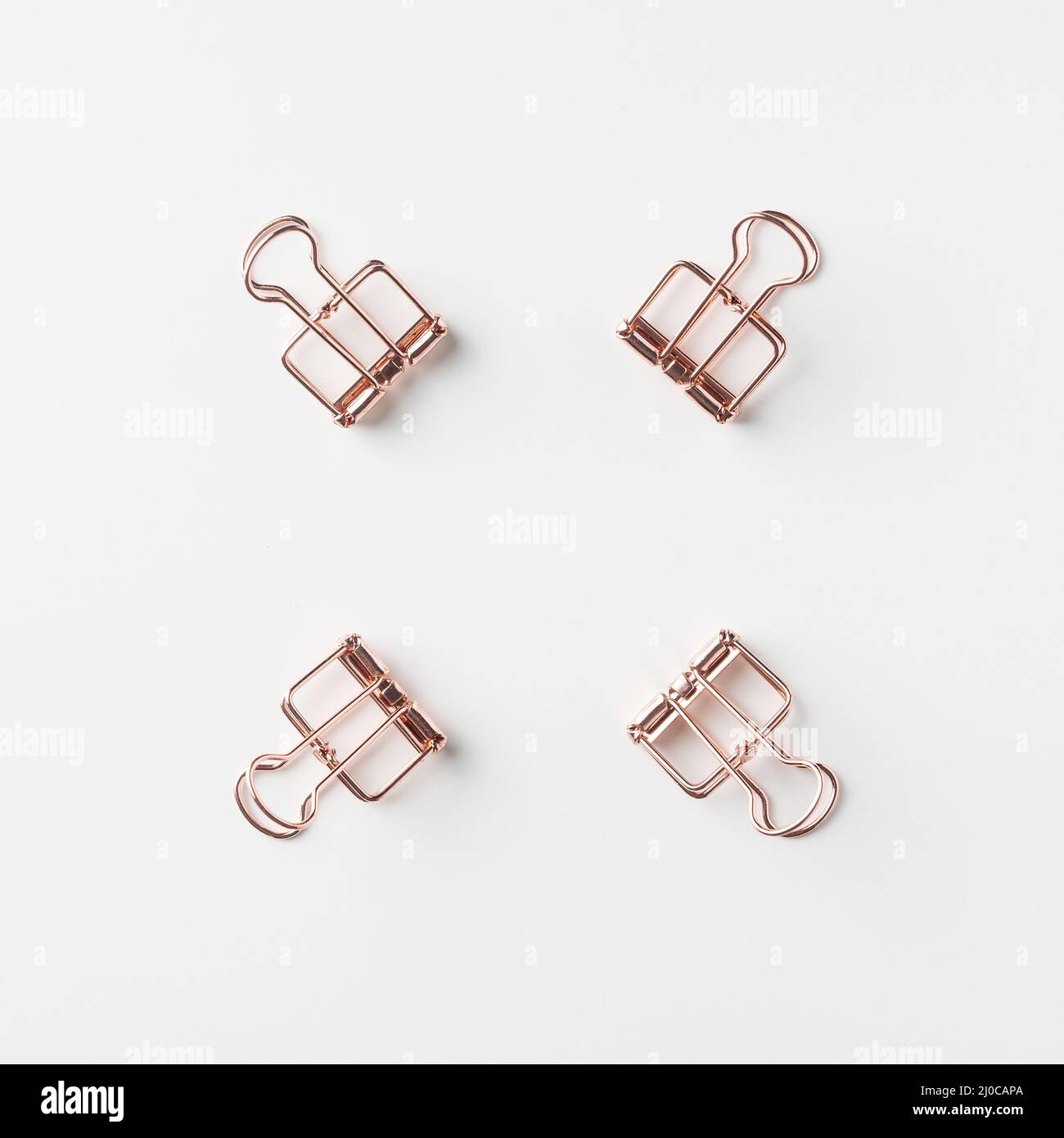 Top view of empty copper clip on white background desk for mockup Stock ...