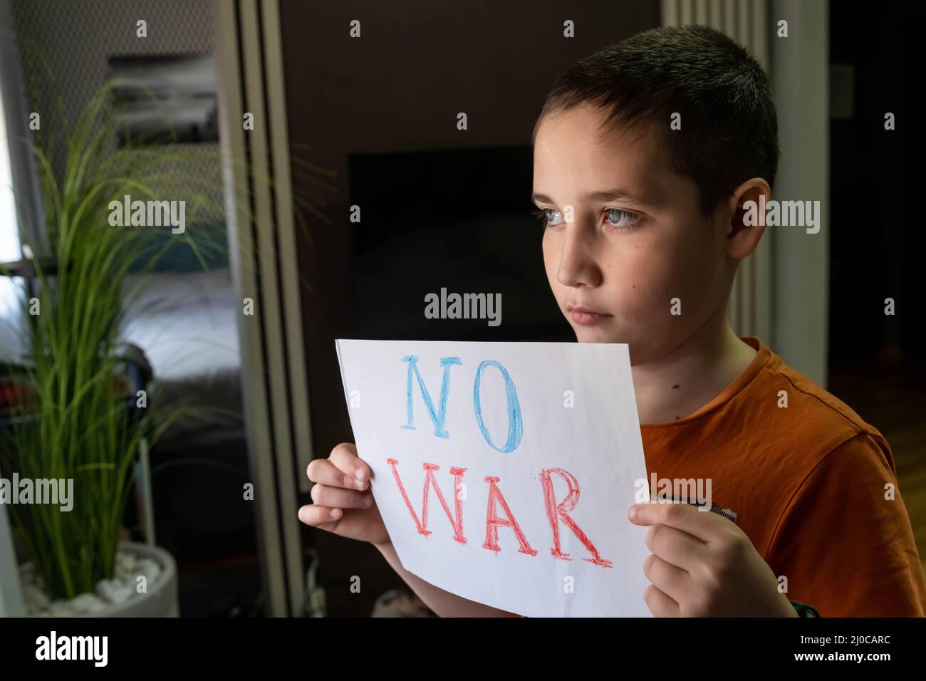 Slogan of peace without war. Child with message Stop War Stock Photo ...