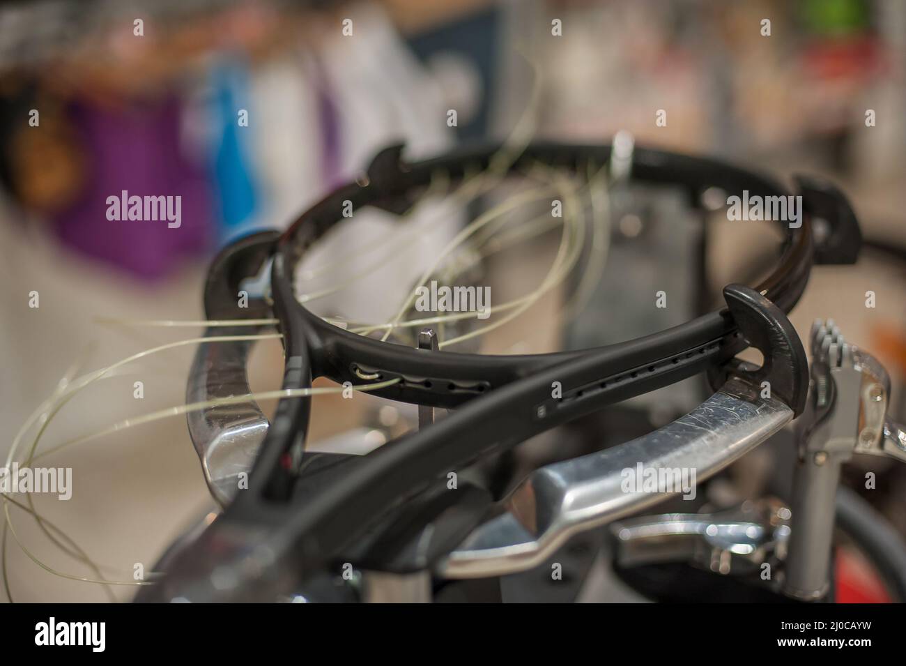 Racket stringing. Detail of tennis racket in the stringing machine ...