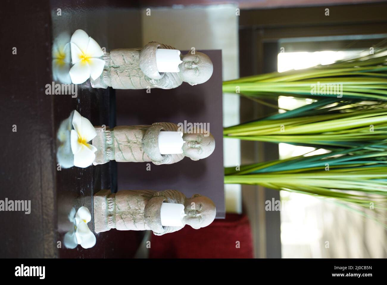 Shot of three statues in a house Stock Photo - Alamy