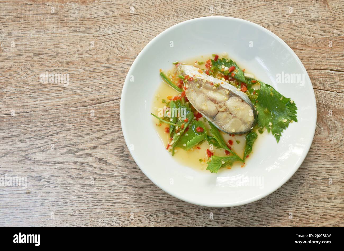 steamed dolly fish with chili and lemon dressings celery on plate Stock ...