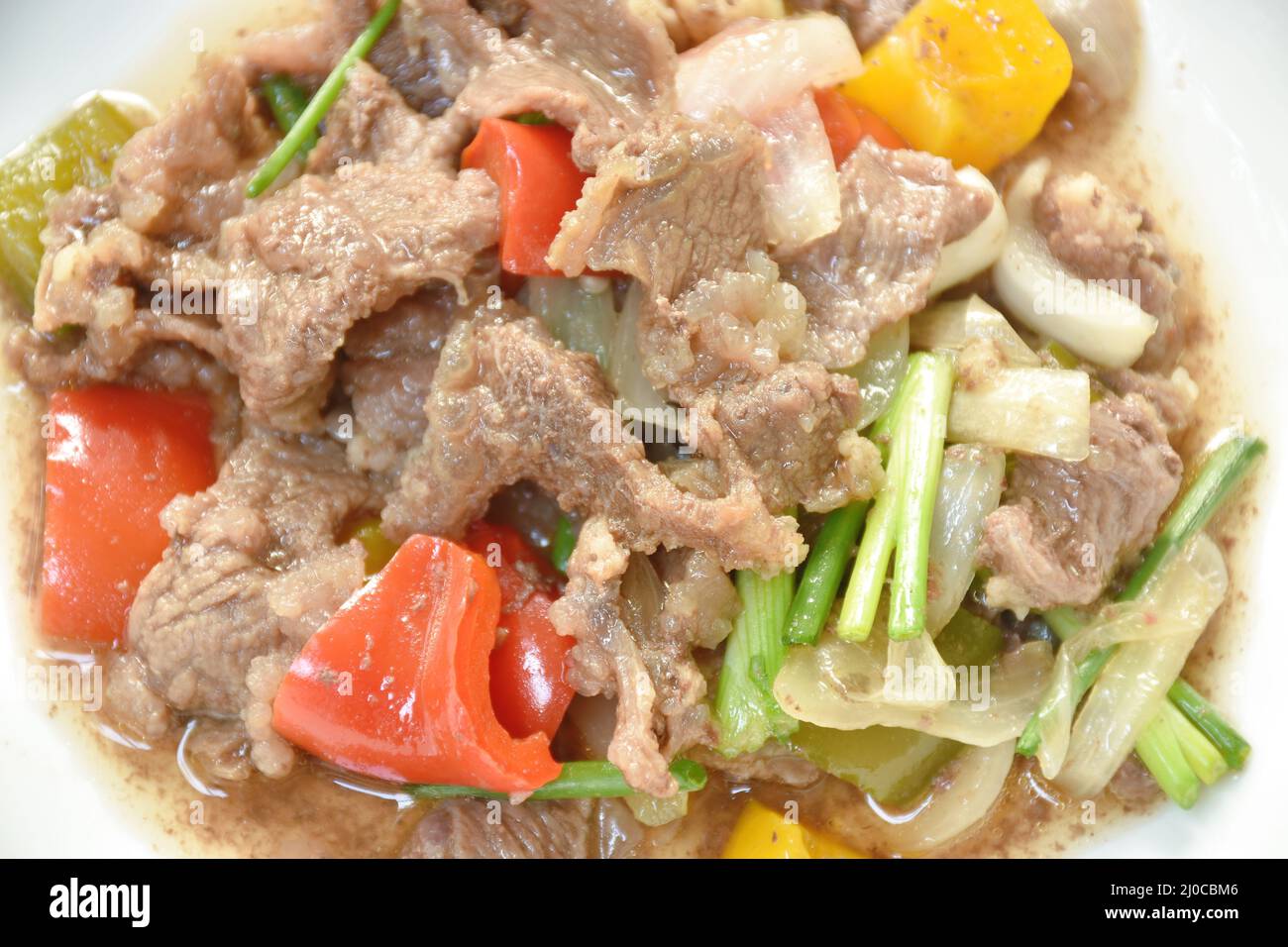 fried slice beef meat tendon with onion and bell pepper in oyster sauce ...