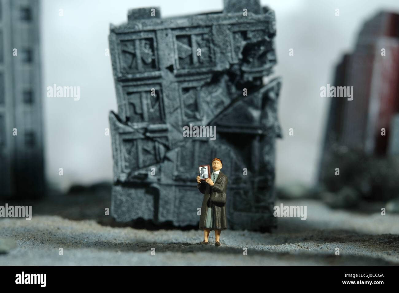 Miniature people toy figure photography. A woman holding photo frame ...