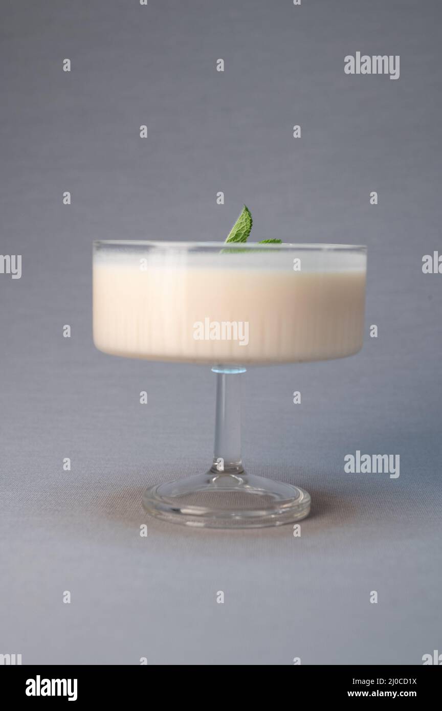 Vertical shot of a White Rabbit Cocktail with Gin Vanilla Paste Cream ...