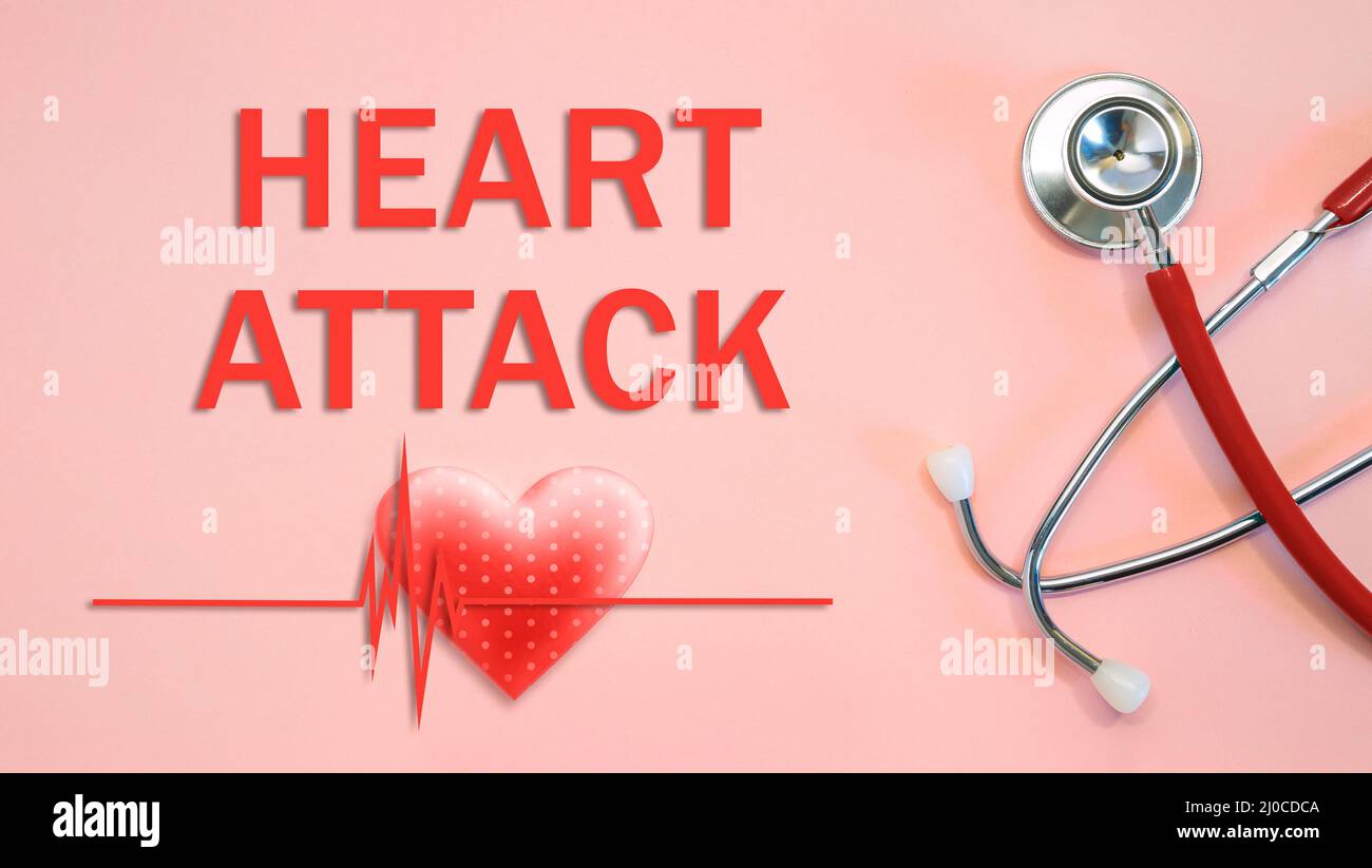 HEART ATTACK concept with stethoscope and heart shape on a pink ...