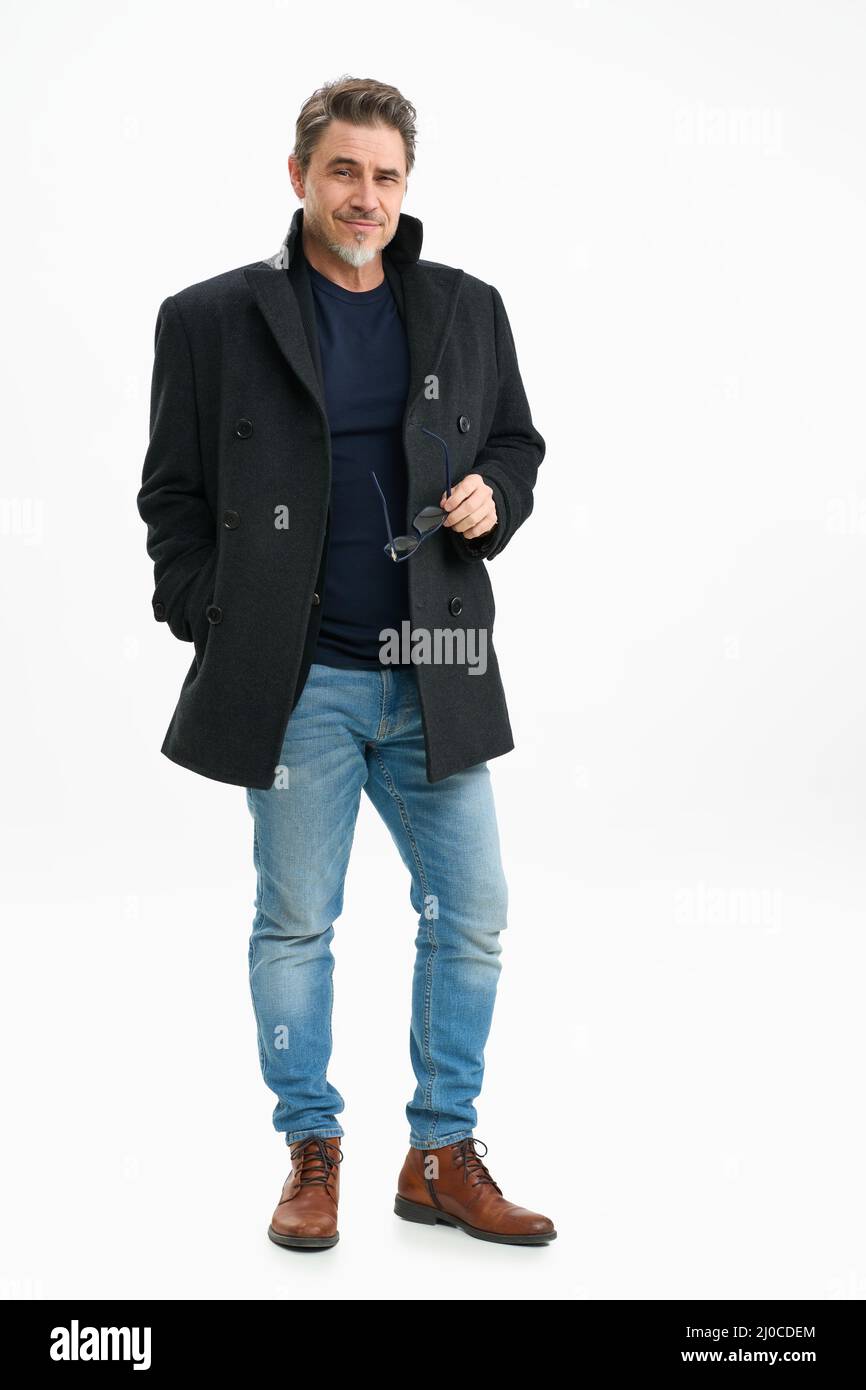 Middle age casual man in coat and jeans. Mid adult, mature age, happy ...
