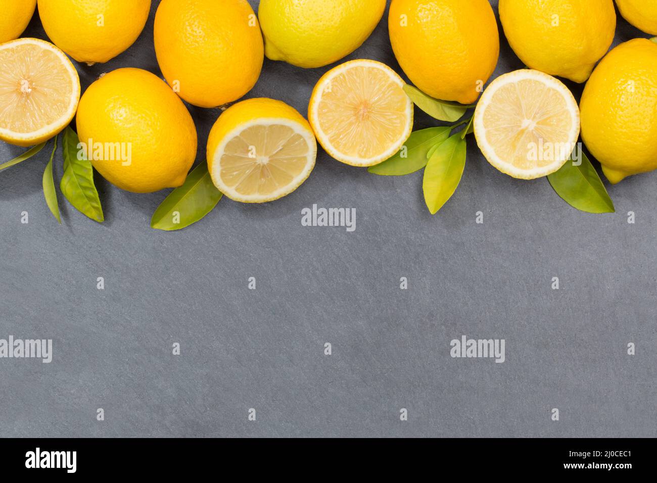 Lemon lemons fruits text free space slate from above Stock Photo - Alamy
