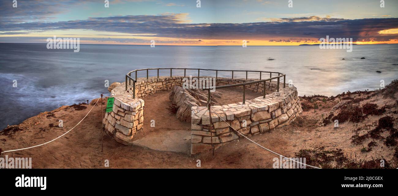 Sunset in a stone overlook that views Crystal Cove State Park Beach ...
