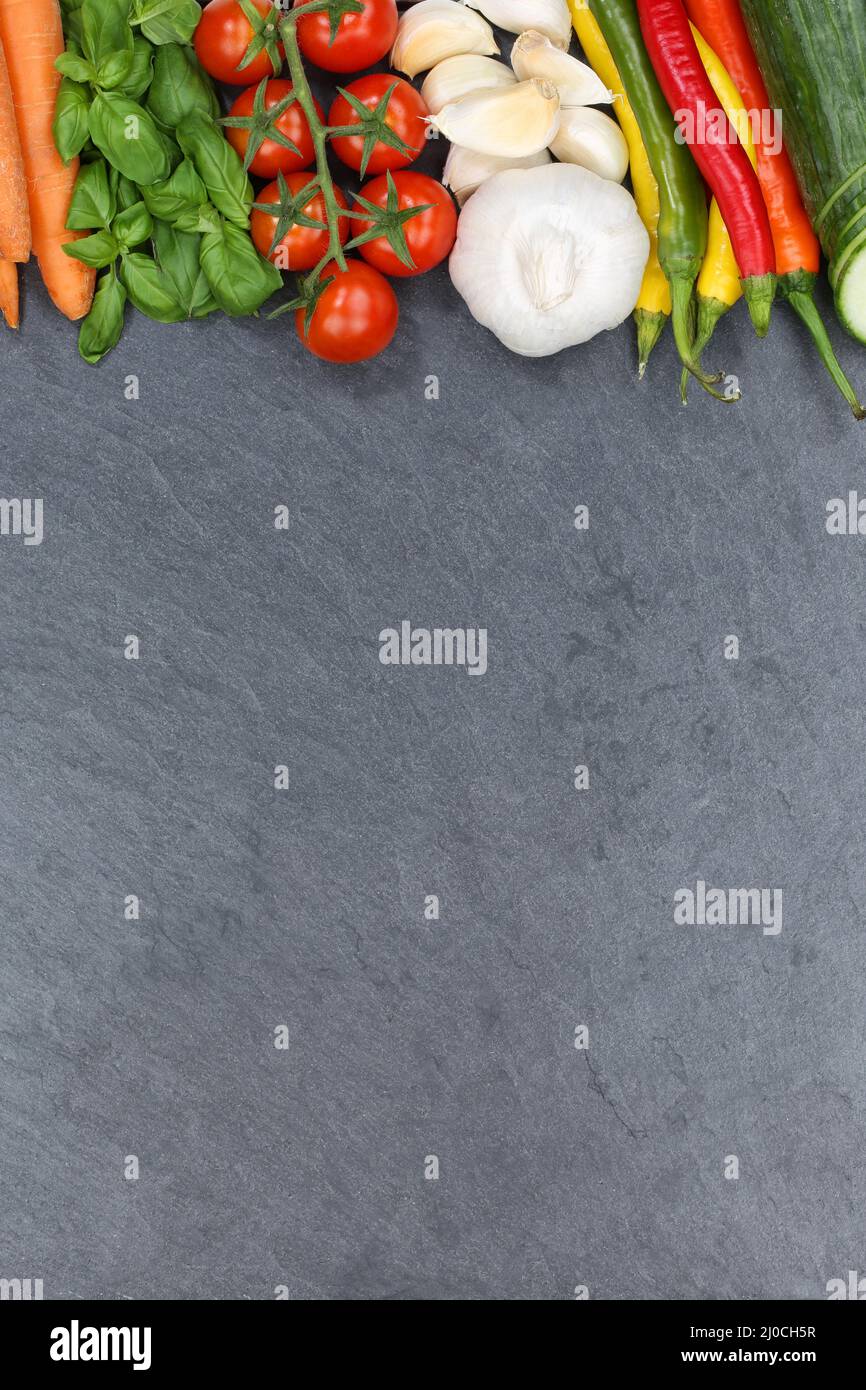 Vegetable collection tomatoes carrots peppers cooking ingredients slate ...