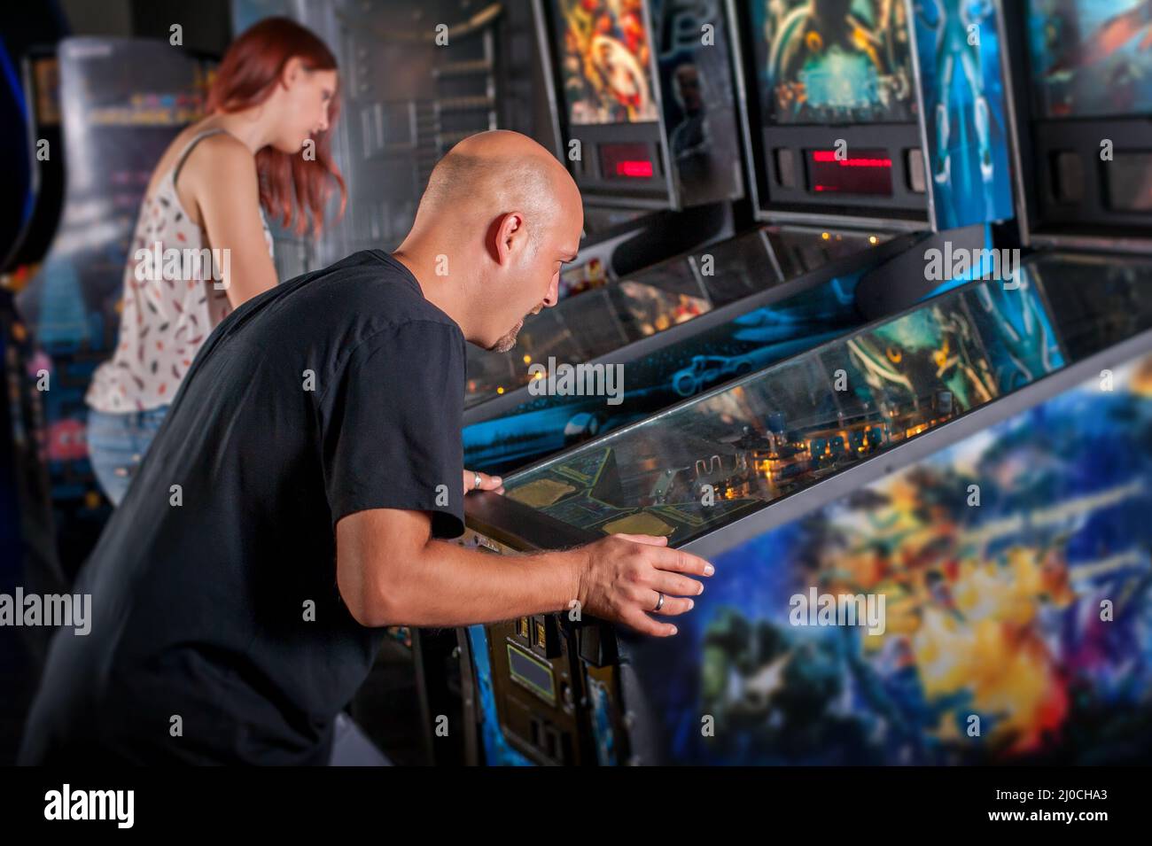 Man playing pinball hi-res stock photography and images - Alamy