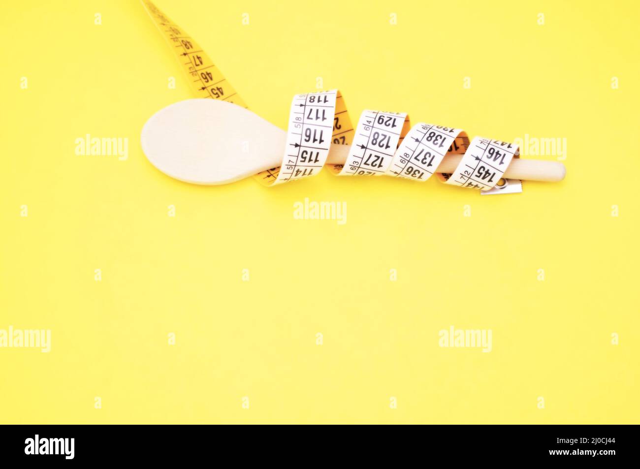 Diet and healthy eating concept - tailor flexible ruler and cutlery ...