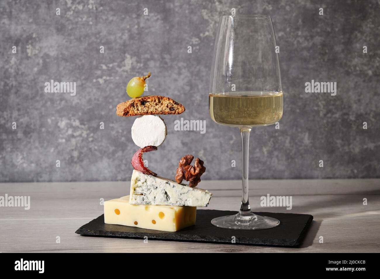 Concept Equilibrium Floating Food and White Wine Glass Stock Photo - Alamy