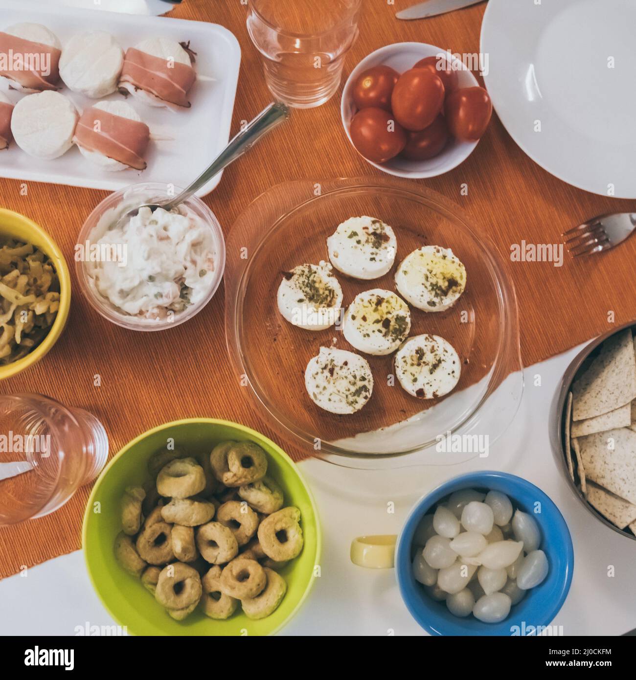 View from the top of a table with many foods ready for an aperitif with ...