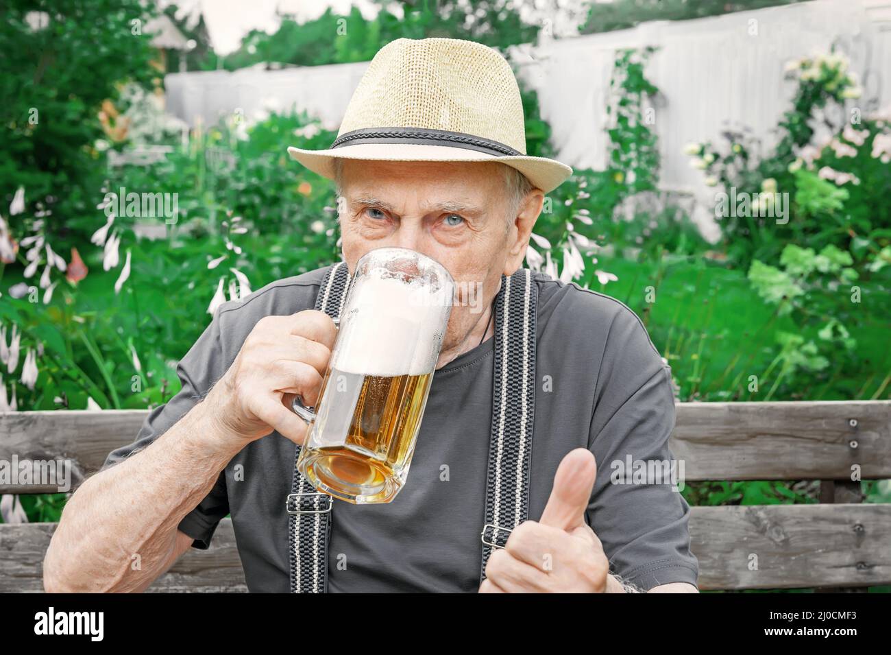 old man with a glass of foamy beer Stock Photo - Alamy