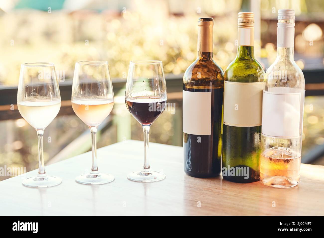 The only way to do wine tasting. Cropped shot of various wines lined up ...