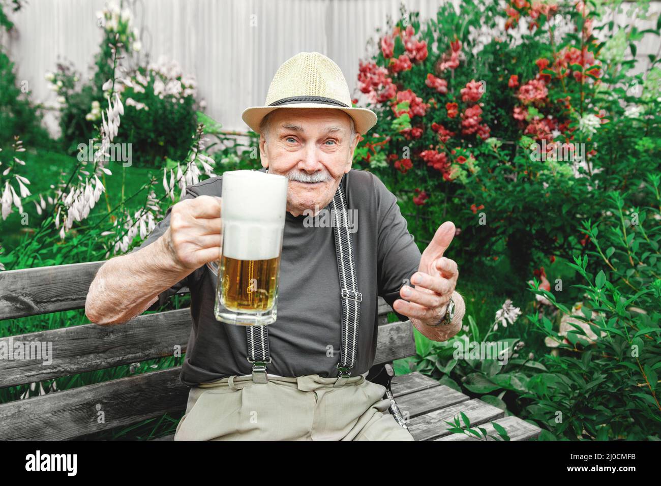 old man with a glass of foamy beer Stock Photo - Alamy